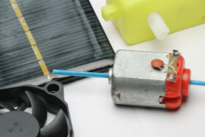 Why a small capacitor is connected across DC motor terminals?